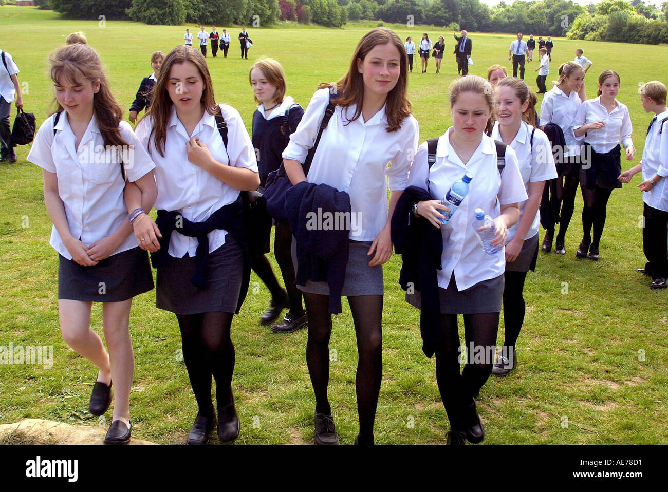 Secondary school children walking in the park Stock Photo - Alamy