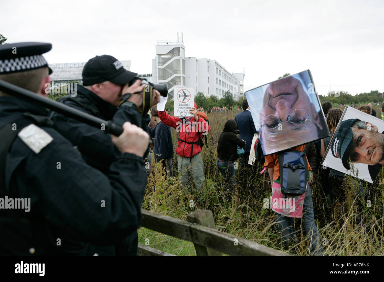 Climate change protesters face up to riot police Stock Photo - Alamy