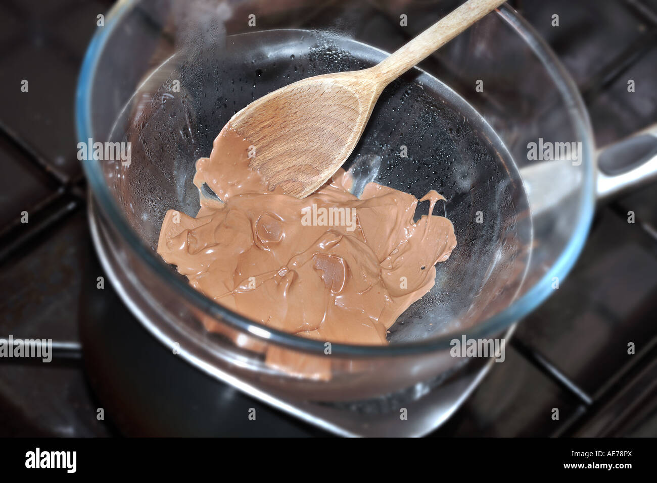 Chocolate melted in bain marie Stock Photo - Alamy