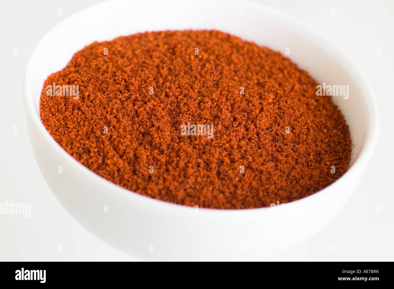 dried red paprika traditional Hungarian spice in white bowl Stock Photo ...