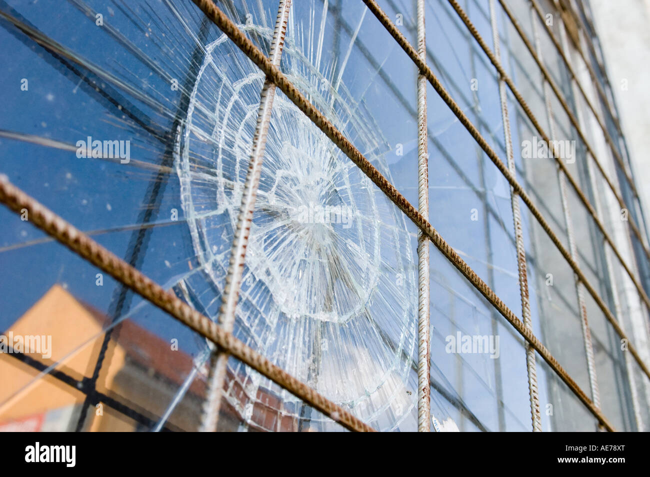 broken window with security steel bars Stock Photo - Alamy
