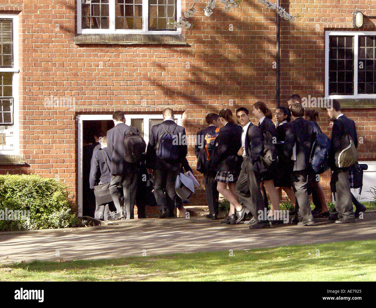 Secondary school children walking into school building Stock Photo ...