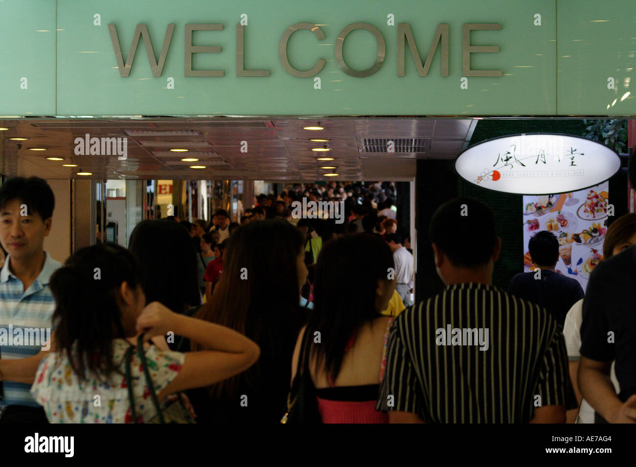 Crowd of Shoppers under a Welcome Sign at a Shopping Center in Hong ...