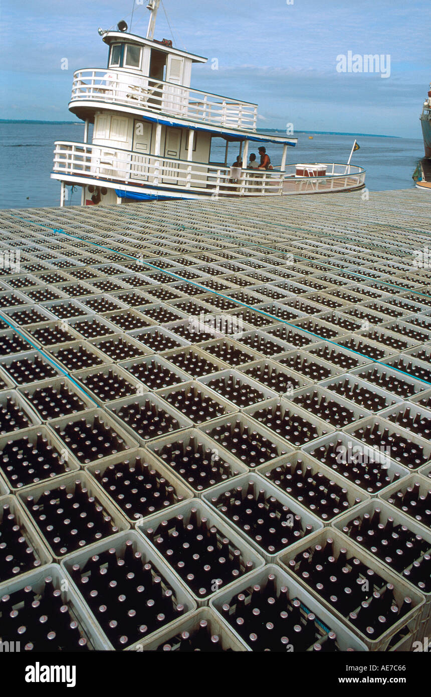 Bottles of beer ready for shipment on the docks of the Amazon River in ...
