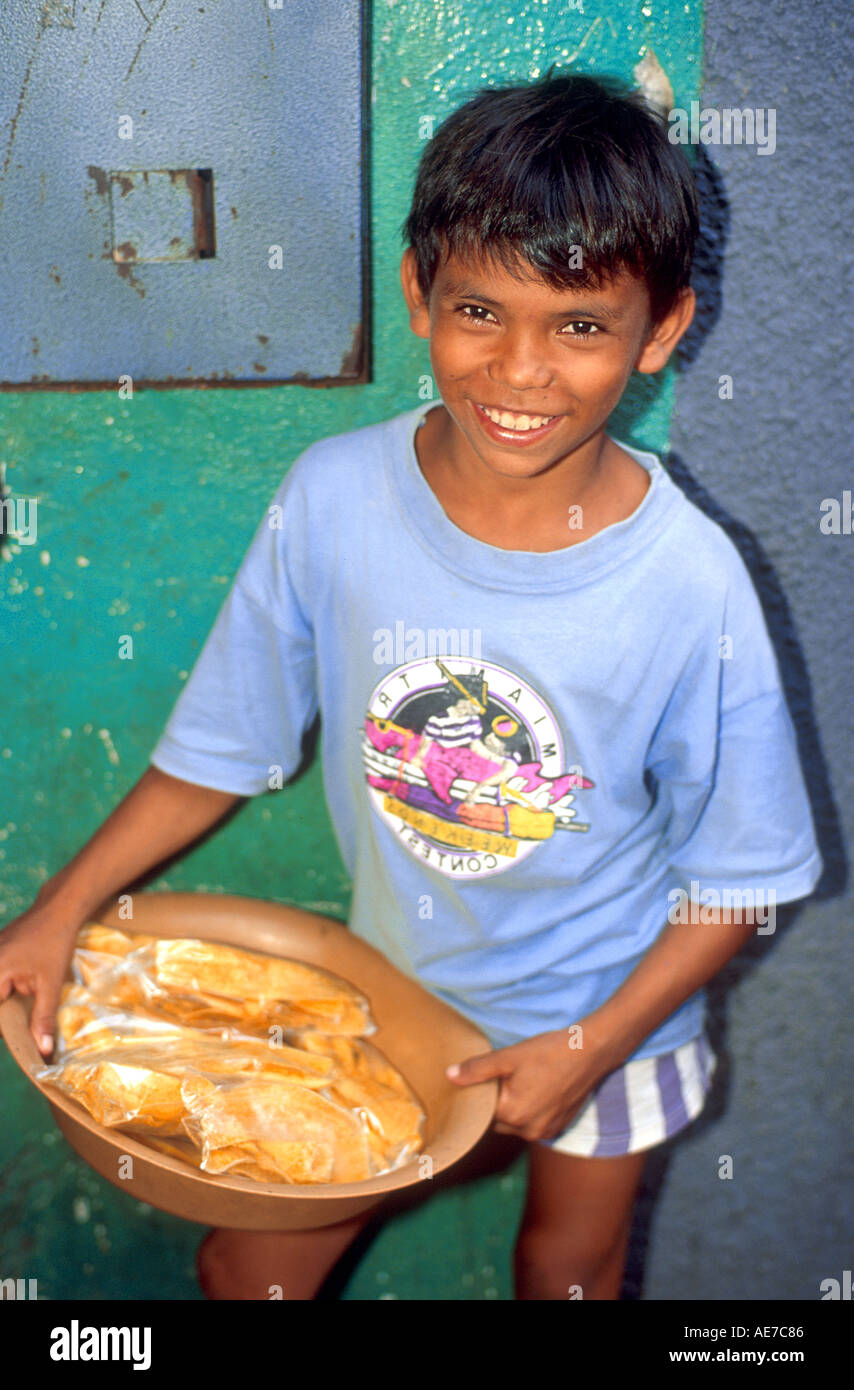 Young Brazillian boy street vendor selling dried fruit in Manaus Brazil ...