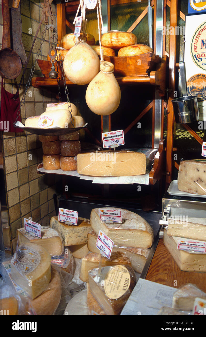 Many flavors and types of cheese on display at store in Turin Italy ...