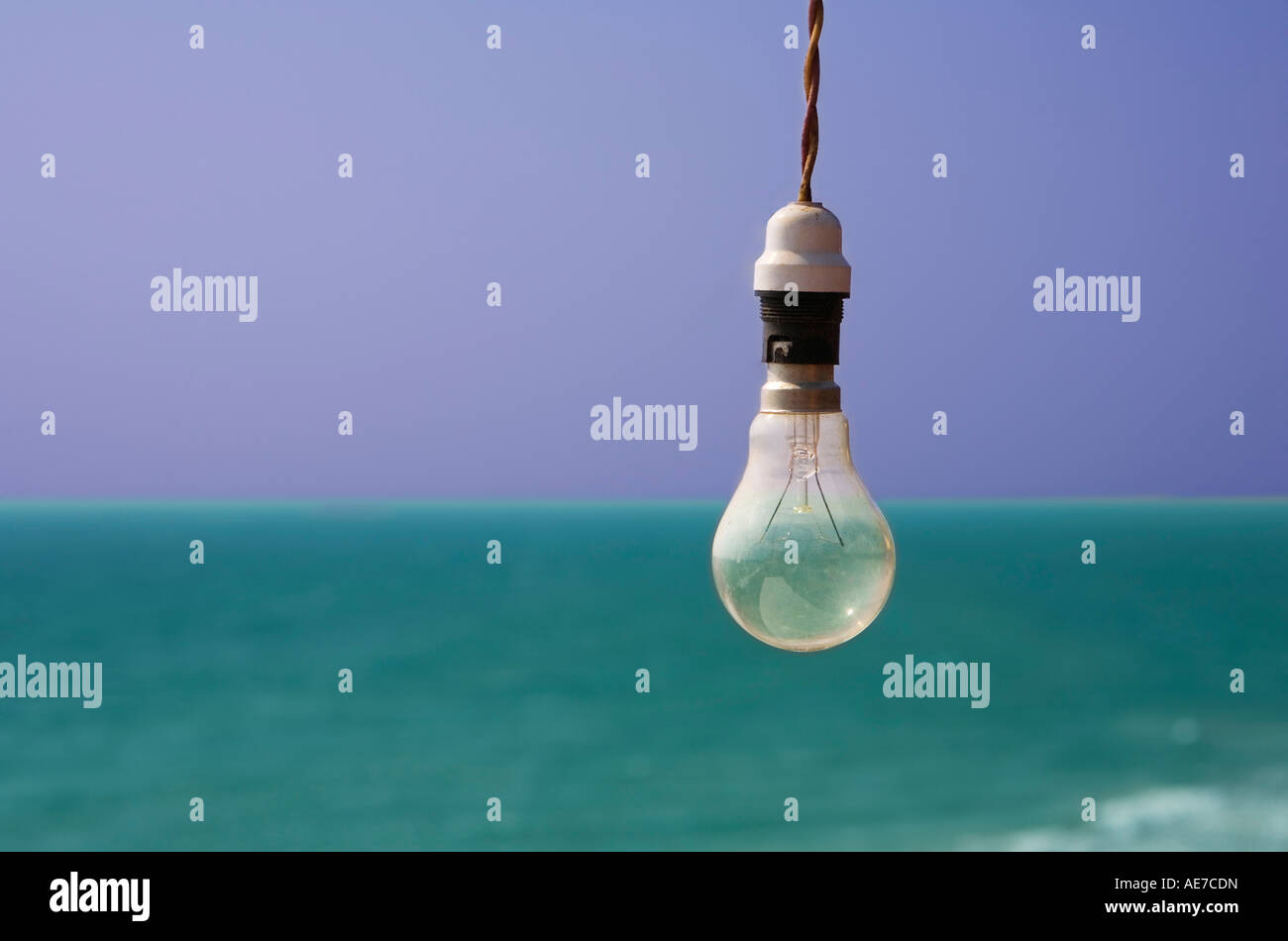 LIGHTBULB HANGING INFRONT OF HORIZON Stock Photo - Alamy