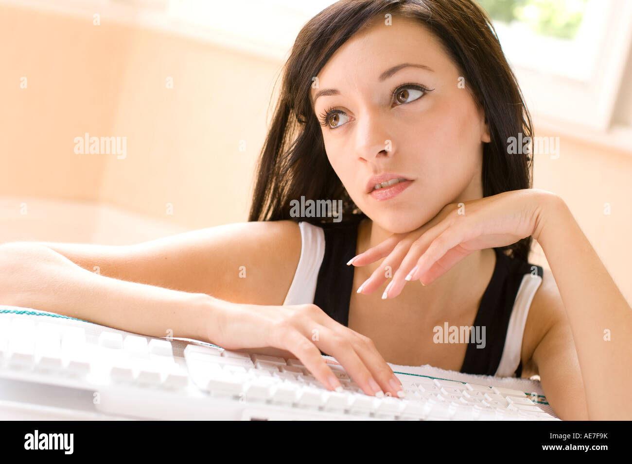 Girl sat at computer Stock Photo - Alamy