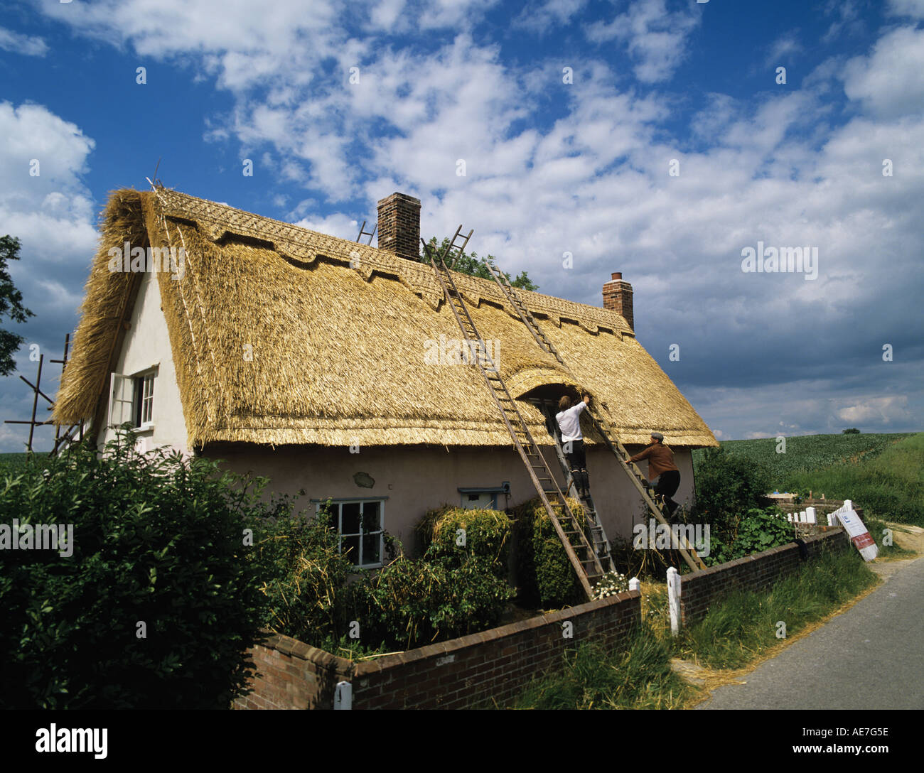 Traditional thatch roof on a refurbished cottage nearing completion ...