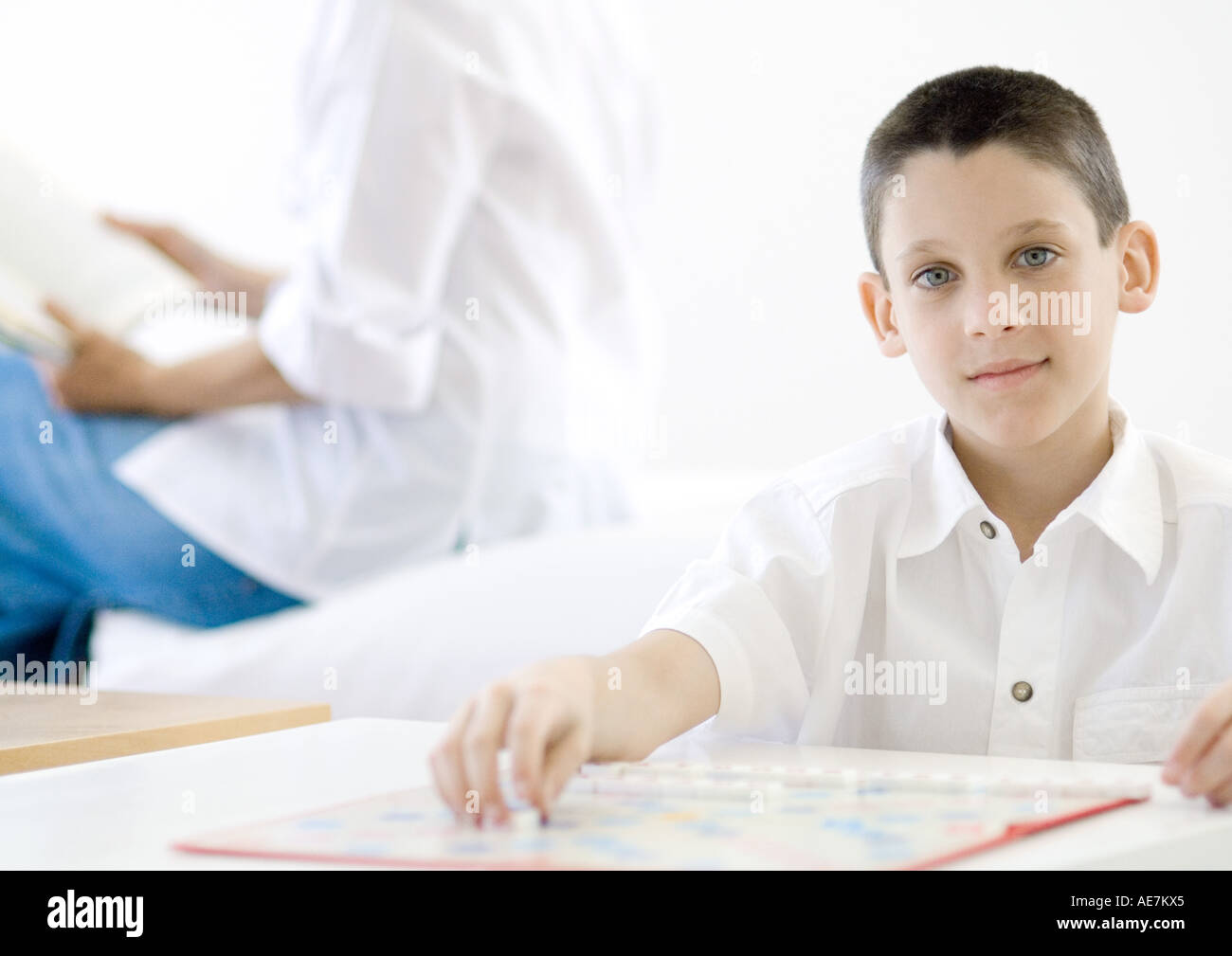 Scrabble board boy hi-res stock photography and images - Alamy