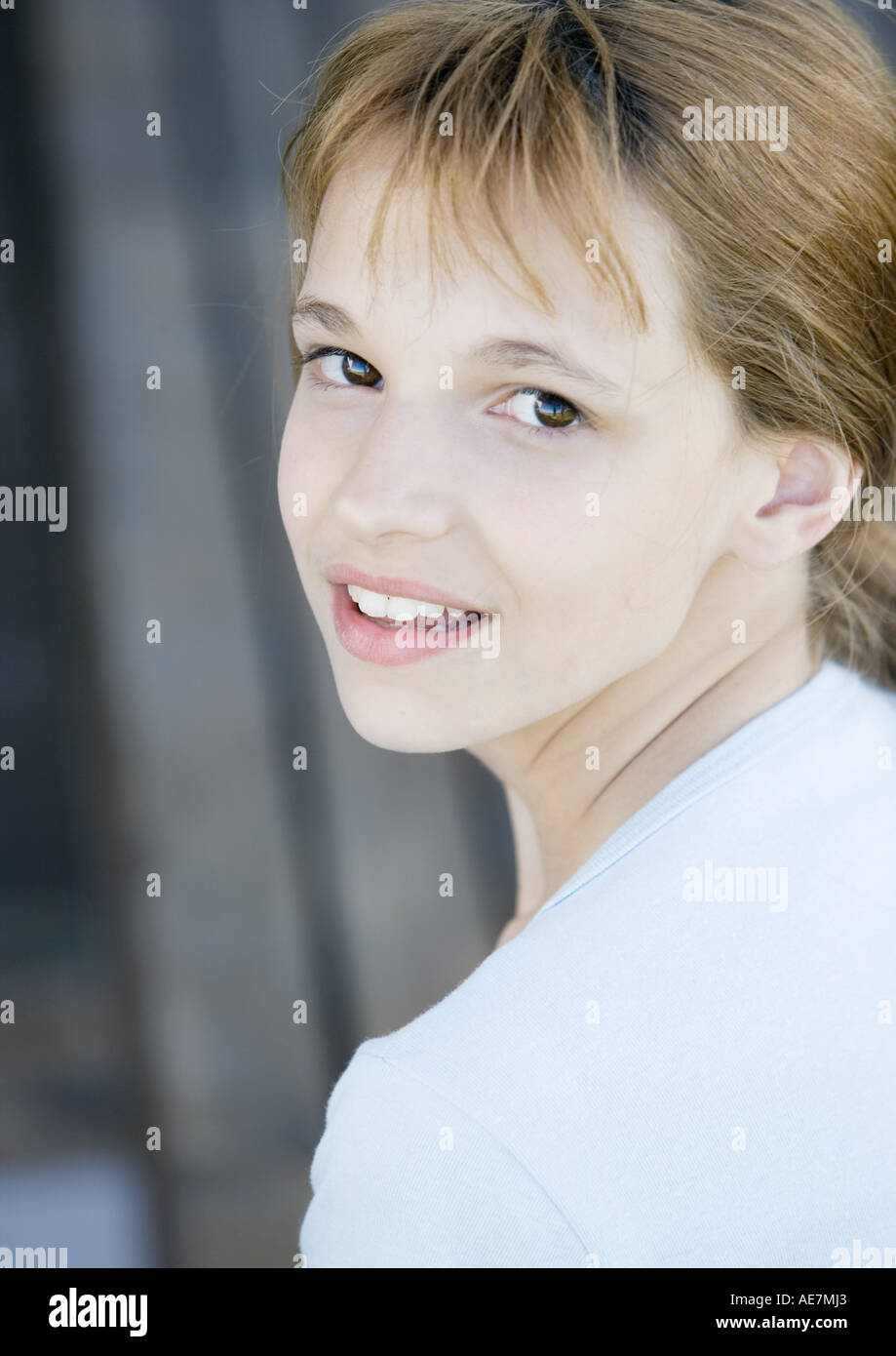 Girl looking over shoulder, portrait Stock Photo - Alamy