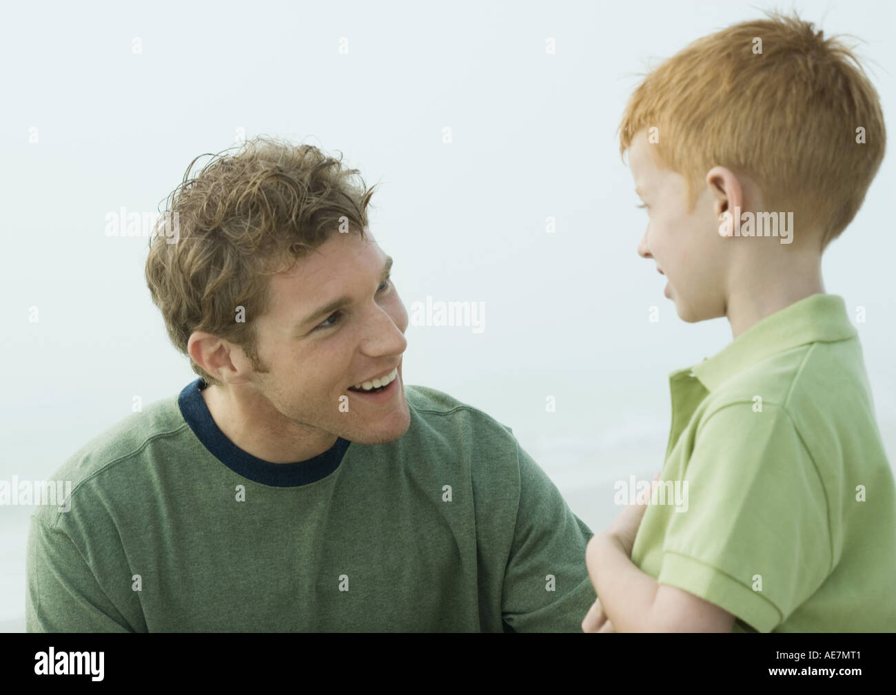 Three children talking outside hi-res stock photography and images - Alamy