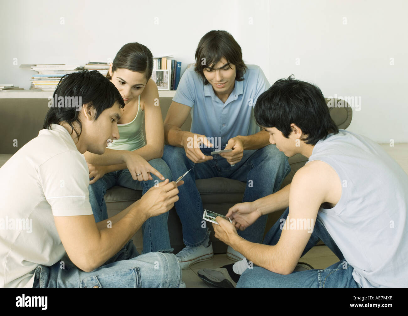 Four friends looking photos hi-res stock photography and images - Alamy