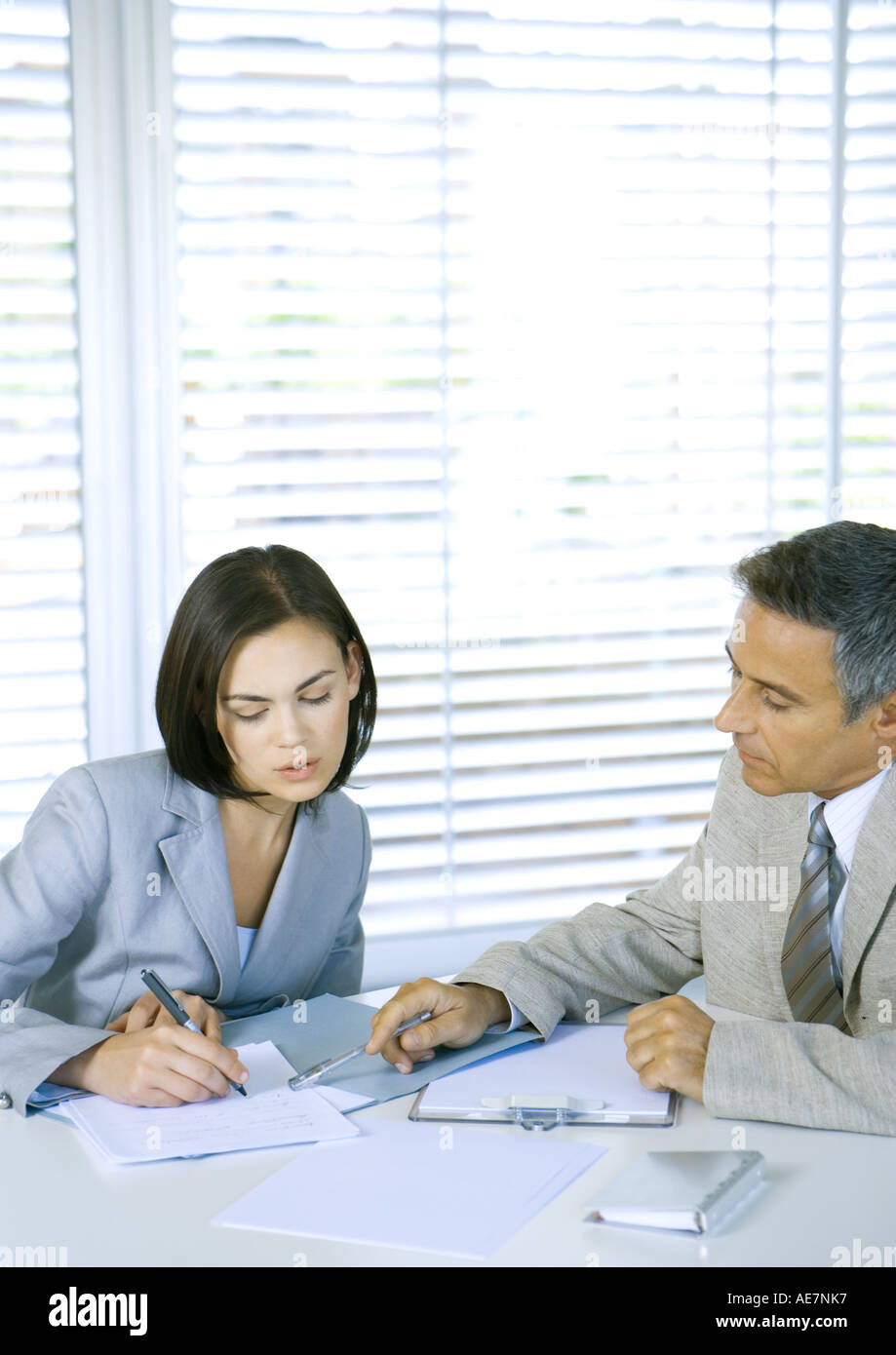 Business women explain documents hi-res stock photography and images ...