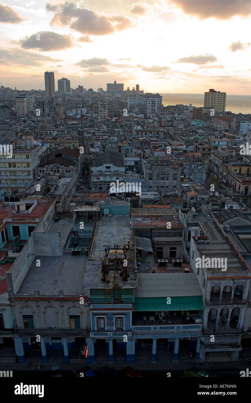 Rooftops of Havana at dusk, with Malecon seafront buttressed by bulk of ...