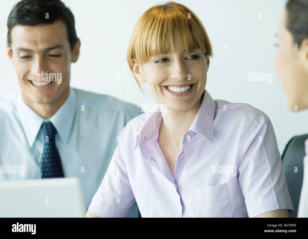 Business colleagues smiling at each other Stock Photo - Alamy