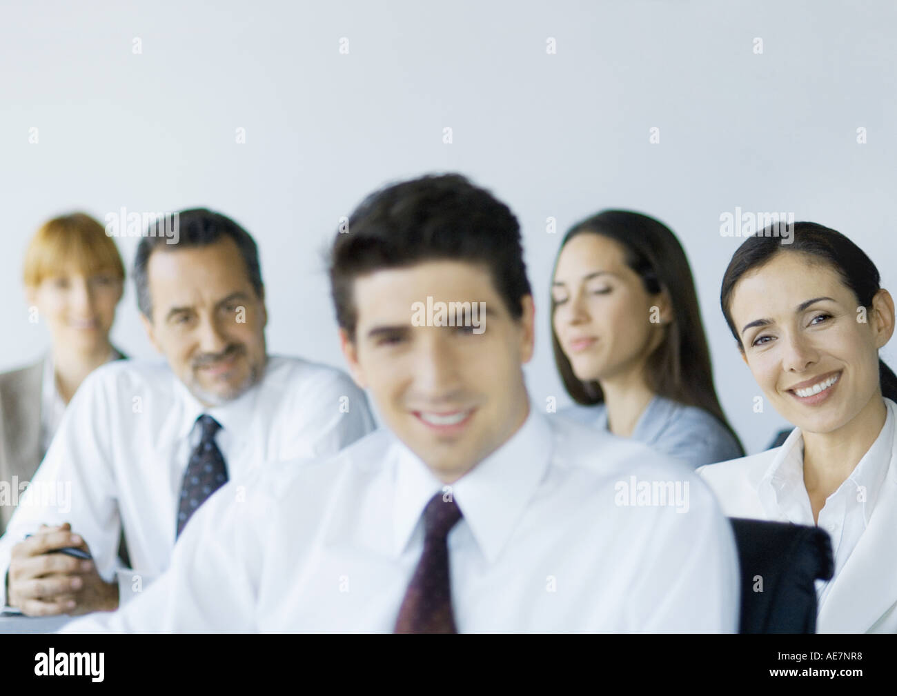 Group of business colleagues smiling Stock Photo - Alamy
