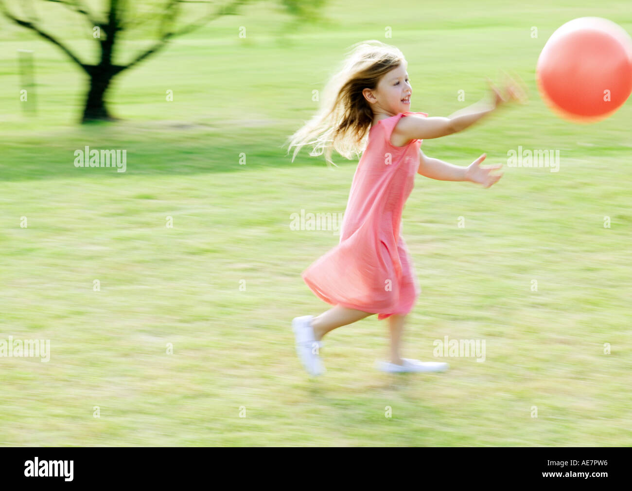 Child chasing ball hi-res stock photography and images - Alamy