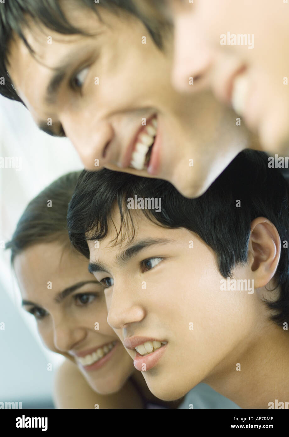 Four young adult faces Stock Photo - Alamy