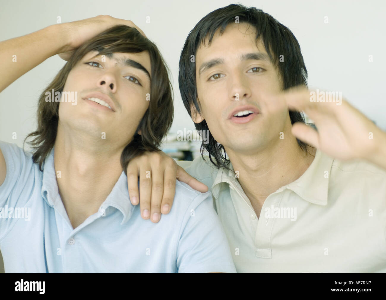 Two young men having emotional reaction Stock Photo - Alamy