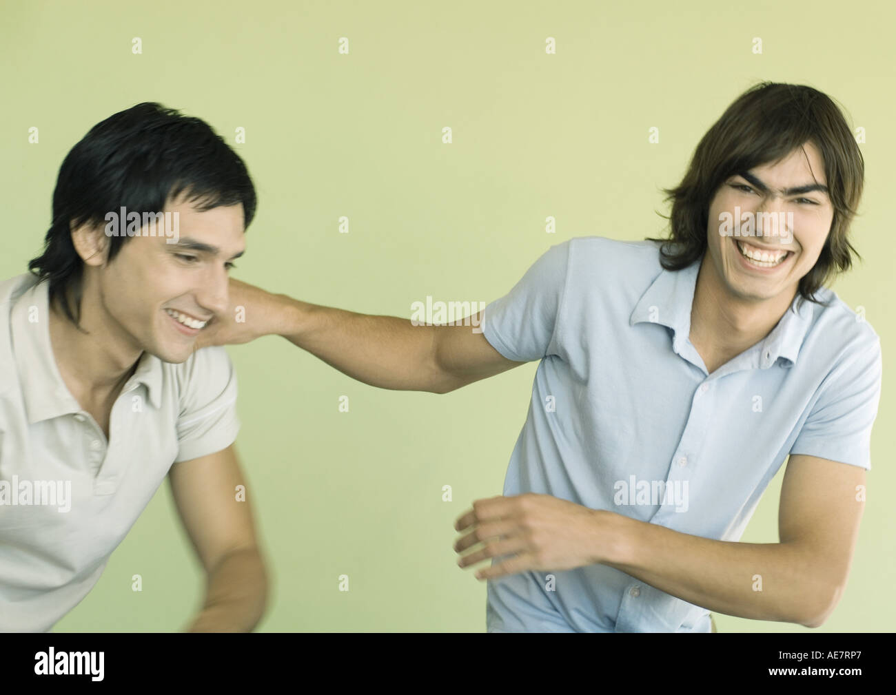 Two young men laughing Stock Photo - Alamy