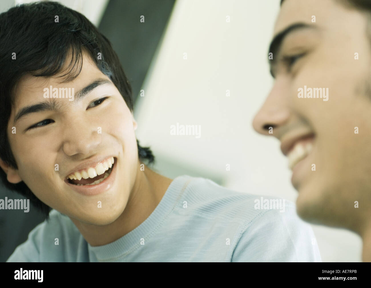 Two young men smiling Stock Photo - Alamy