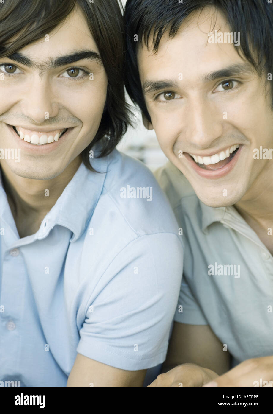 Two young men smiling Stock Photo - Alamy