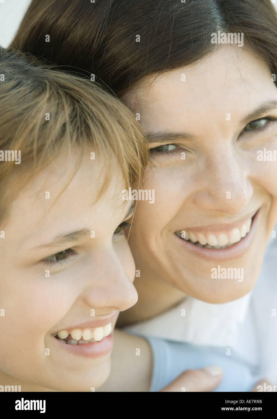 Mother embracing her daughter, both smiling, close-up Stock Photo - Alamy