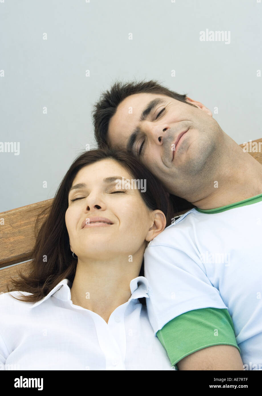 Two couples sitting together sleeping hi-res stock photography and ...