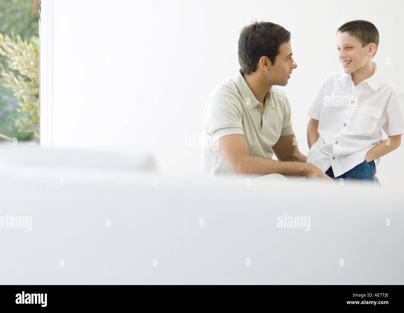 Two kids talking each other hi-res stock photography and images - Alamy