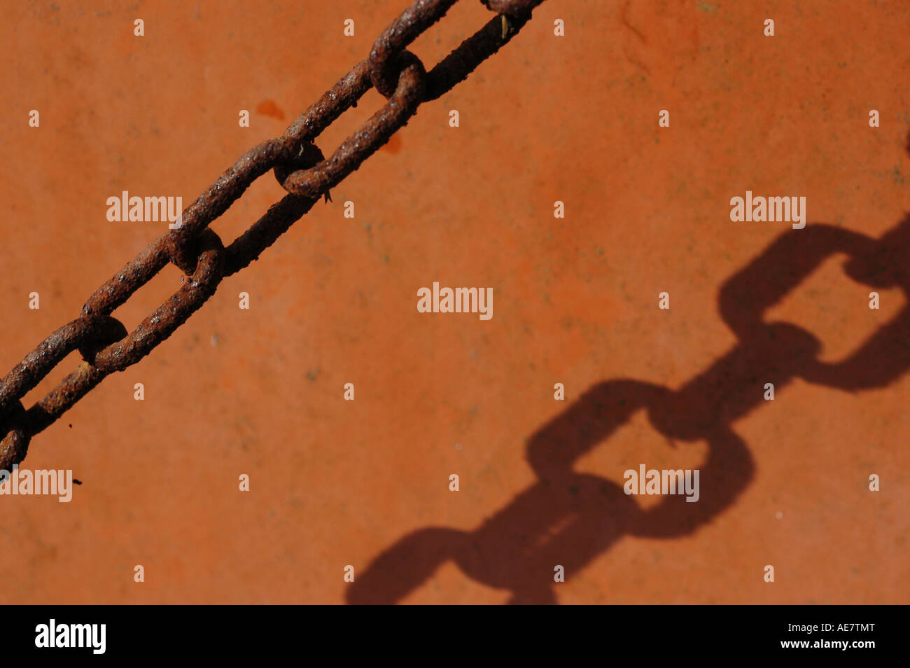 Chain with shadow on an ironwall hi-res stock photography and images ...