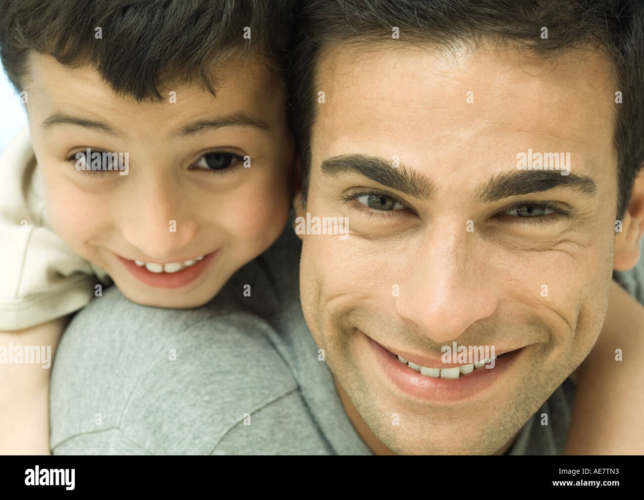 Father and son smiling, close-up of faces Stock Photo - Alamy