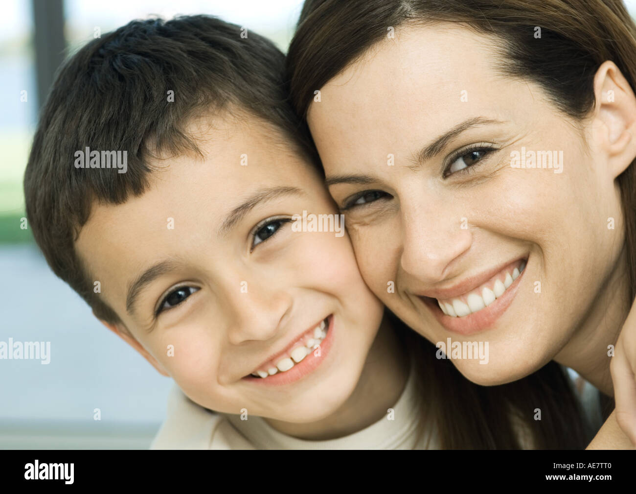 Mother and son smiling cheek to cheek Stock Photo - Alamy