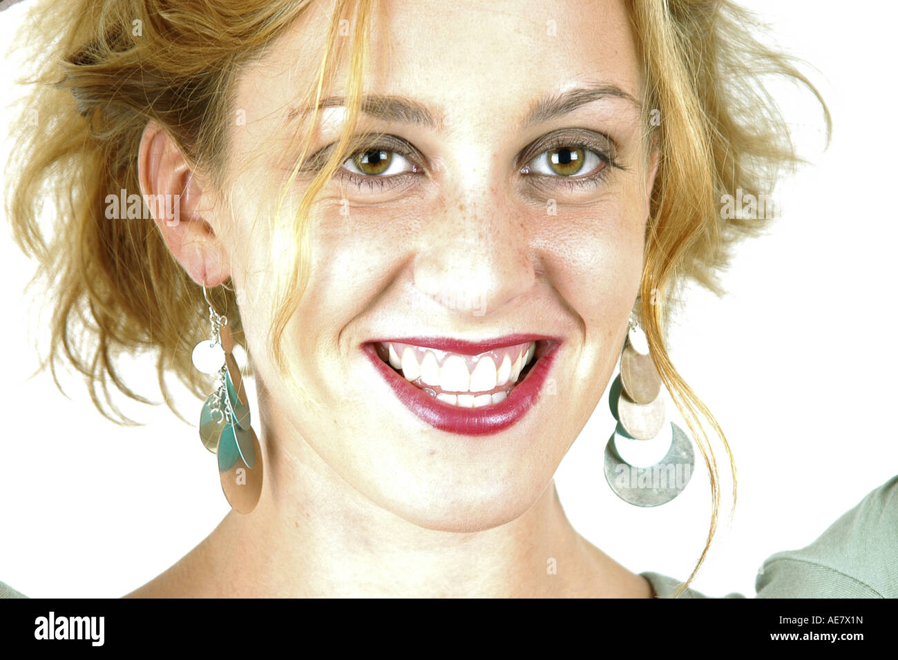 portrait of a laughing young women with earrings, Germany Stock Photo ...