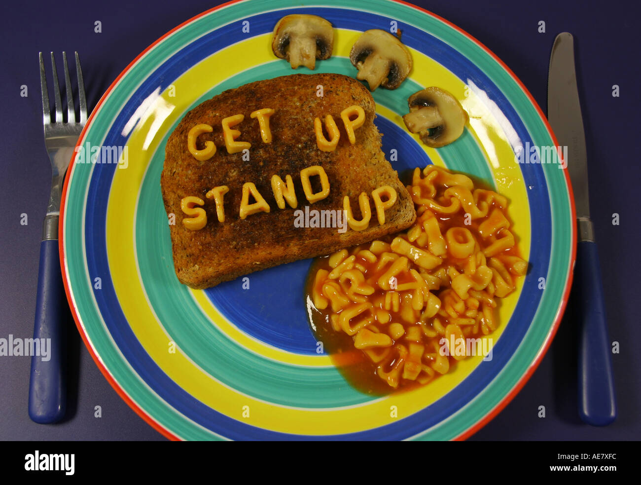 the words get up stand up formed from alphabetti spaghetti on a piece ...