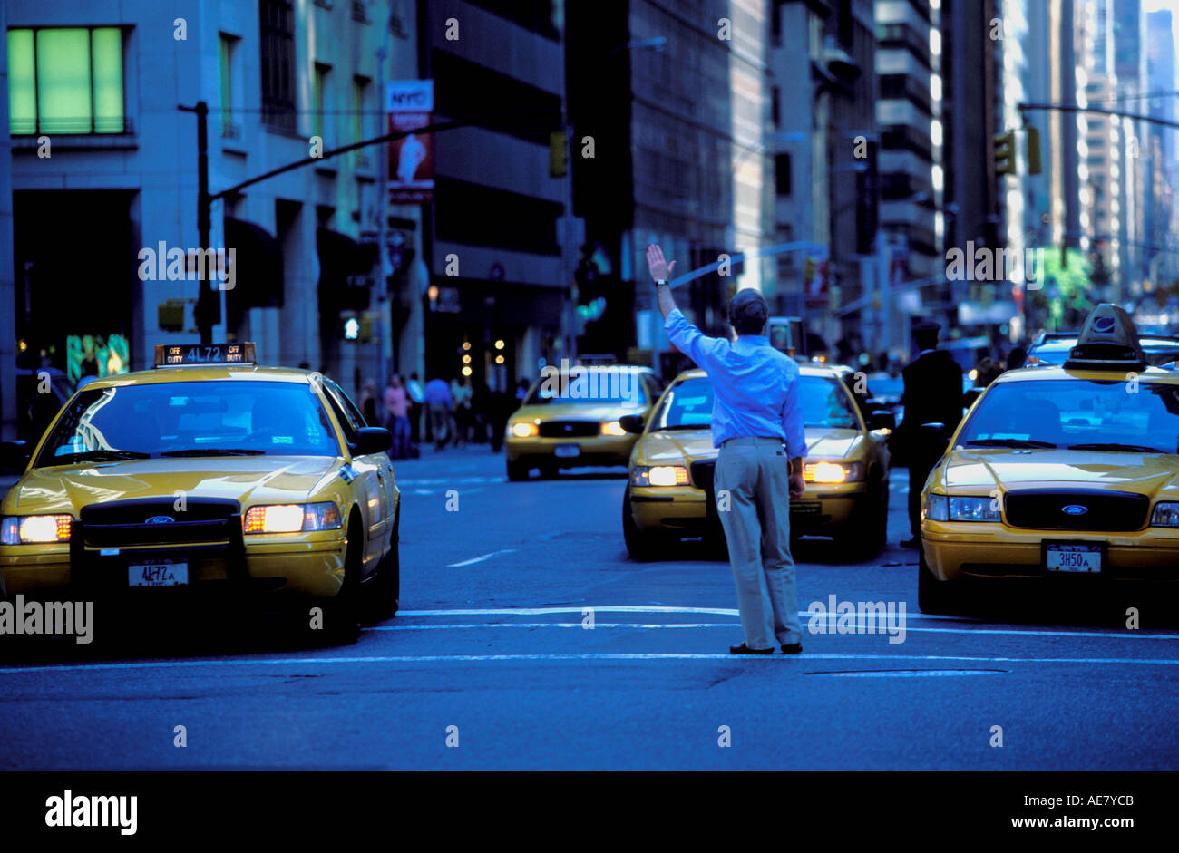 a man hailing a taxi at downtown Manhattan NY USA Stock Photo - Alamy