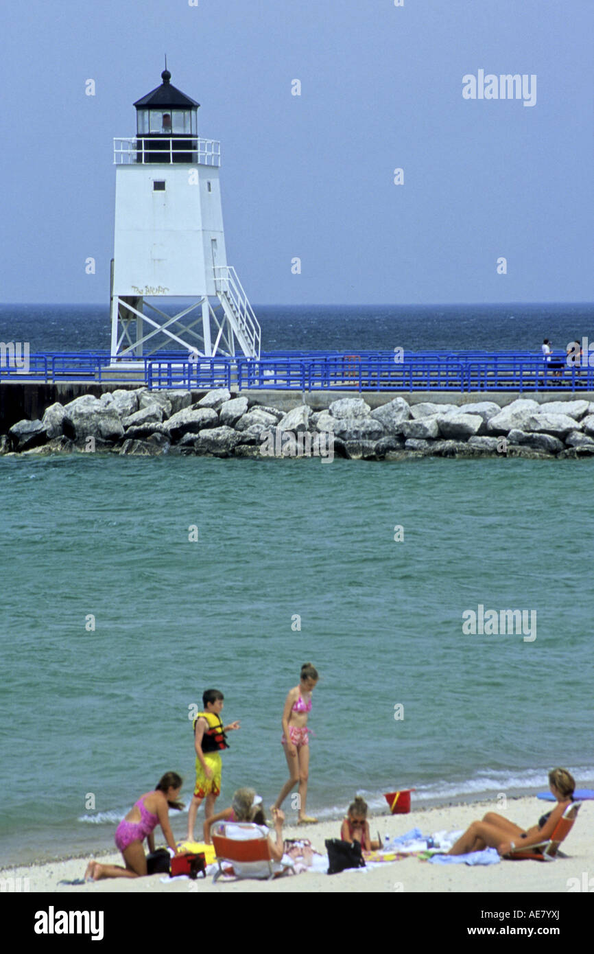 Charlevoix Pierhead light and People on beach, USA, Michigan ...