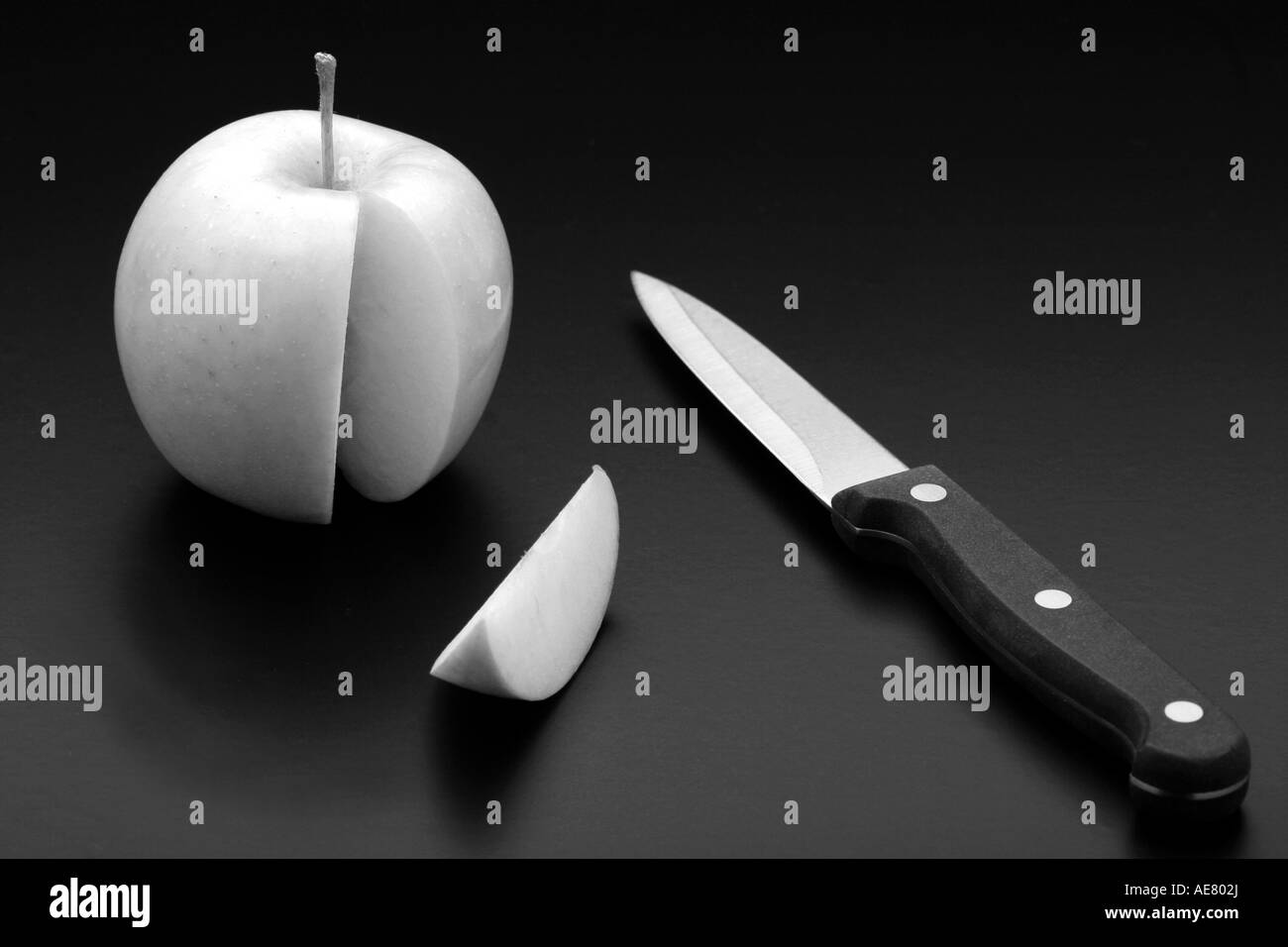 cutted apple with a knife Stock Photo - Alamy
