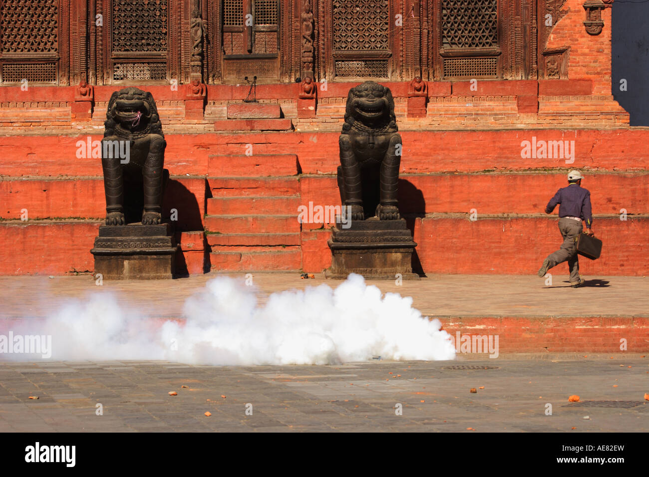 Business man escapes teargas in clash between police and protesters ...