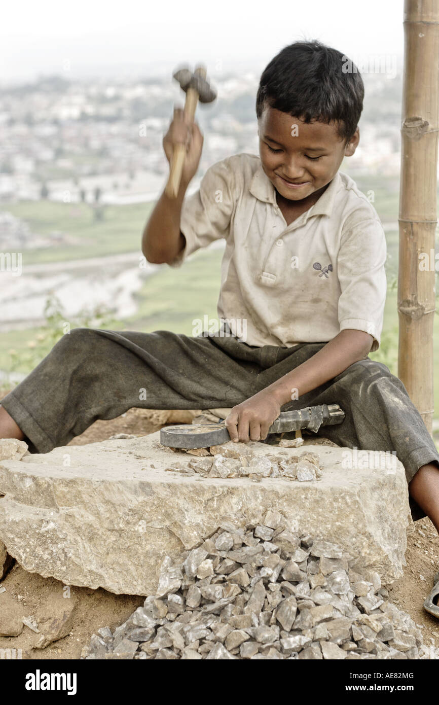 8 year old boy working in stone quarry outside Kathmandu Nepal Stock ...