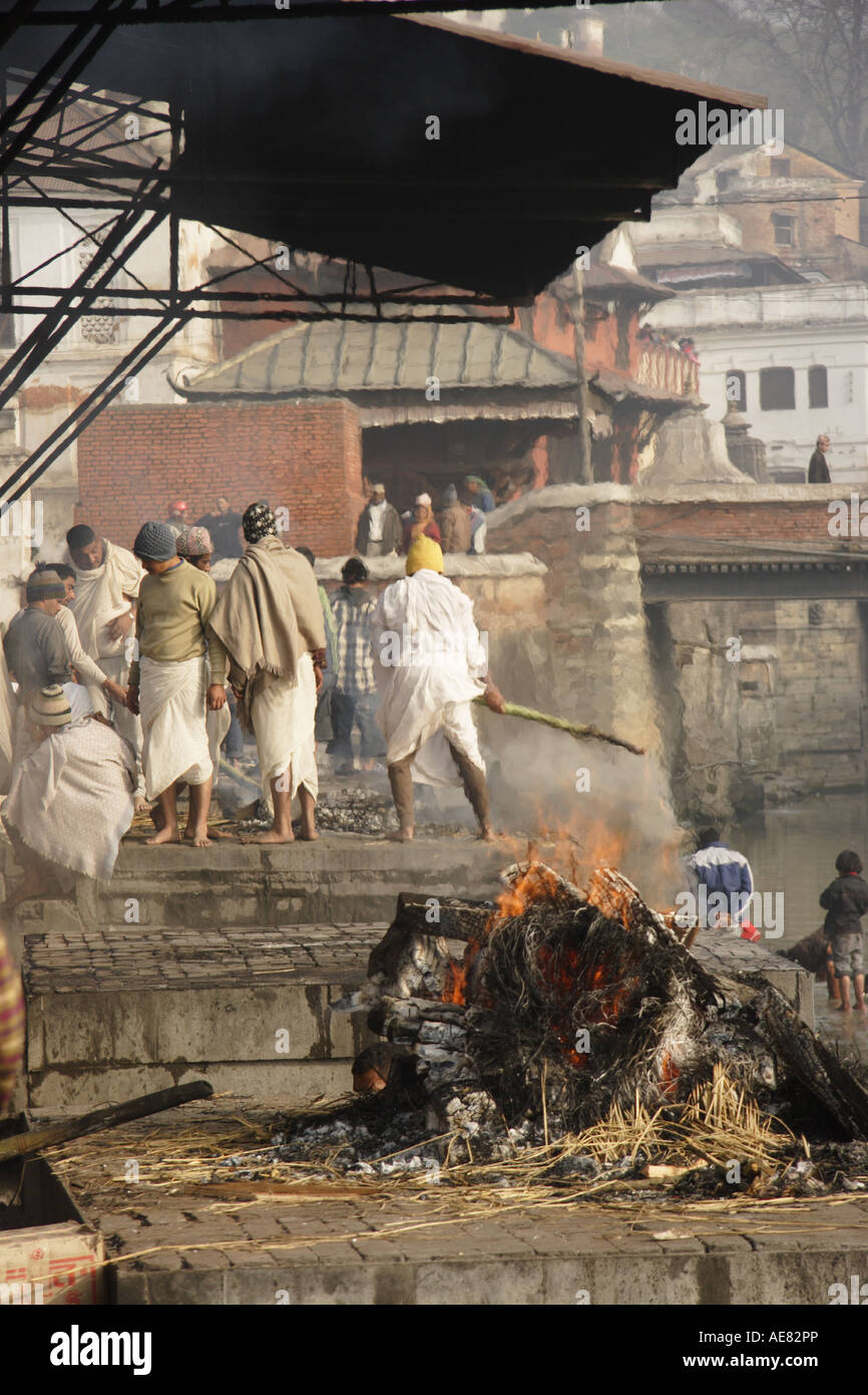 Cremations in progress at the ghat of the holy Bagmati river ...