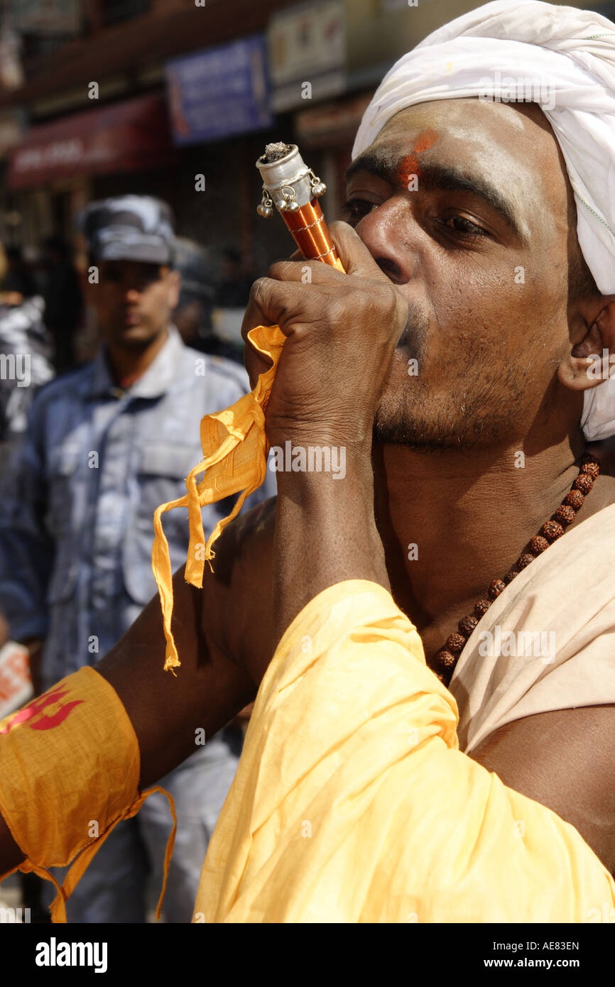 NEPAL - A holy Hindu man takes a puff of his chillum hash pipe in front ...
