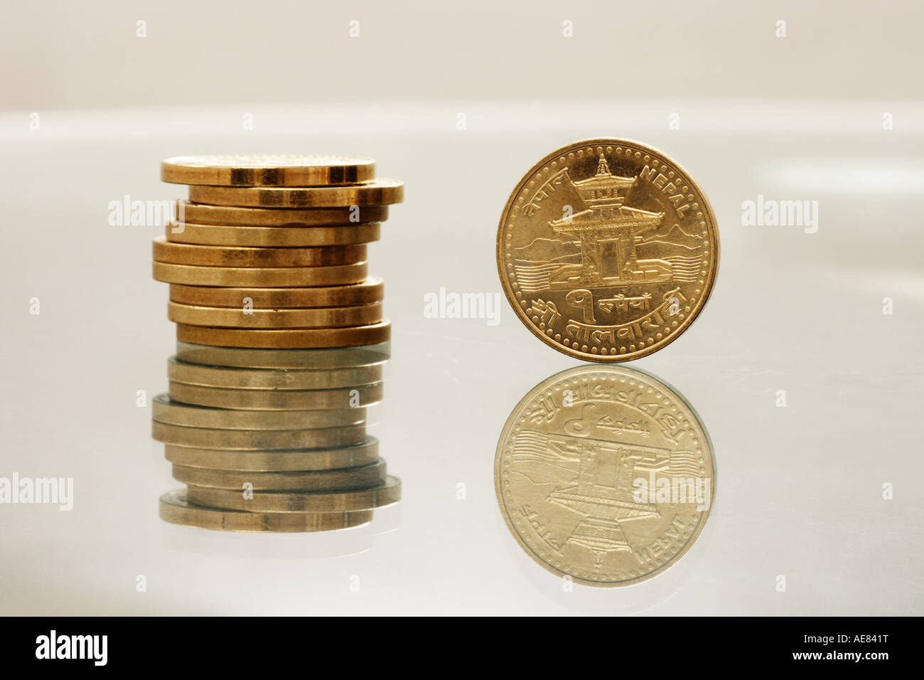 Ten Nepalese one-rupee coins Stock Photo - Alamy