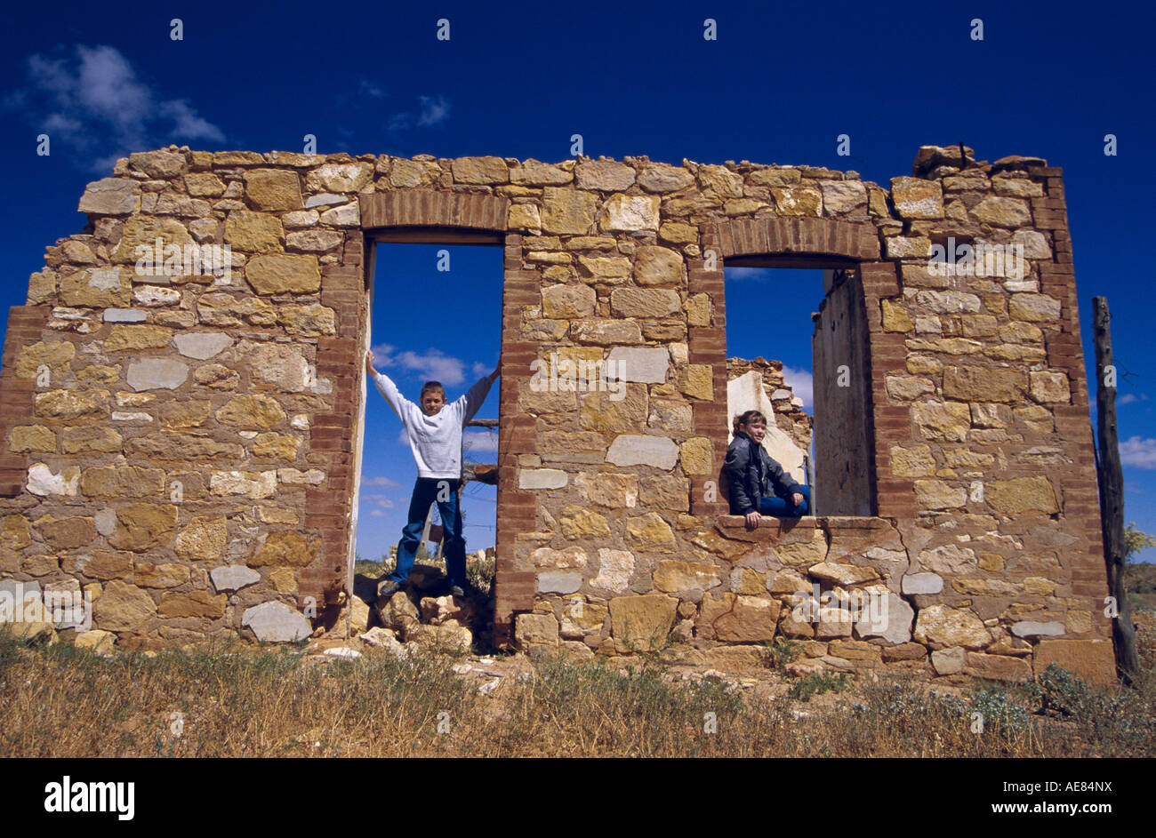 Brother and sister at old ruins, outback Australia Stock Photo - Alamy