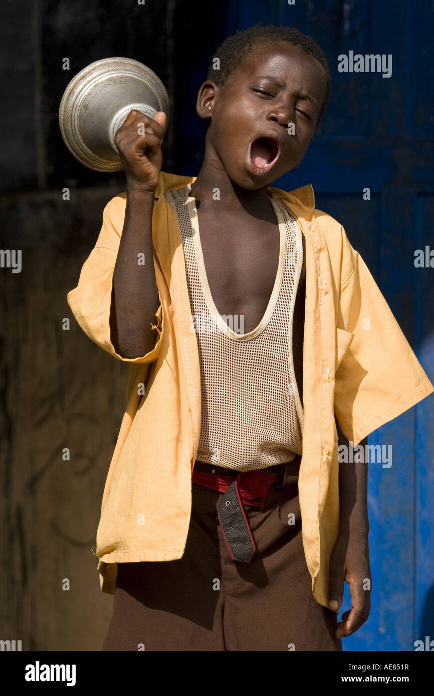 Boy ringing bell at school, Ghana Stock Photo - Alamy