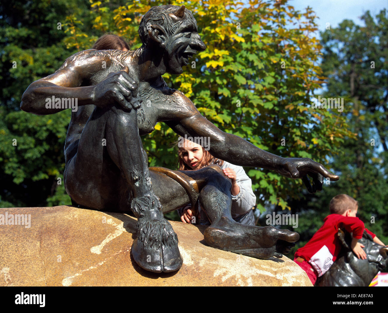 Kids playing on bronze sculpture hi-res stock photography and images ...