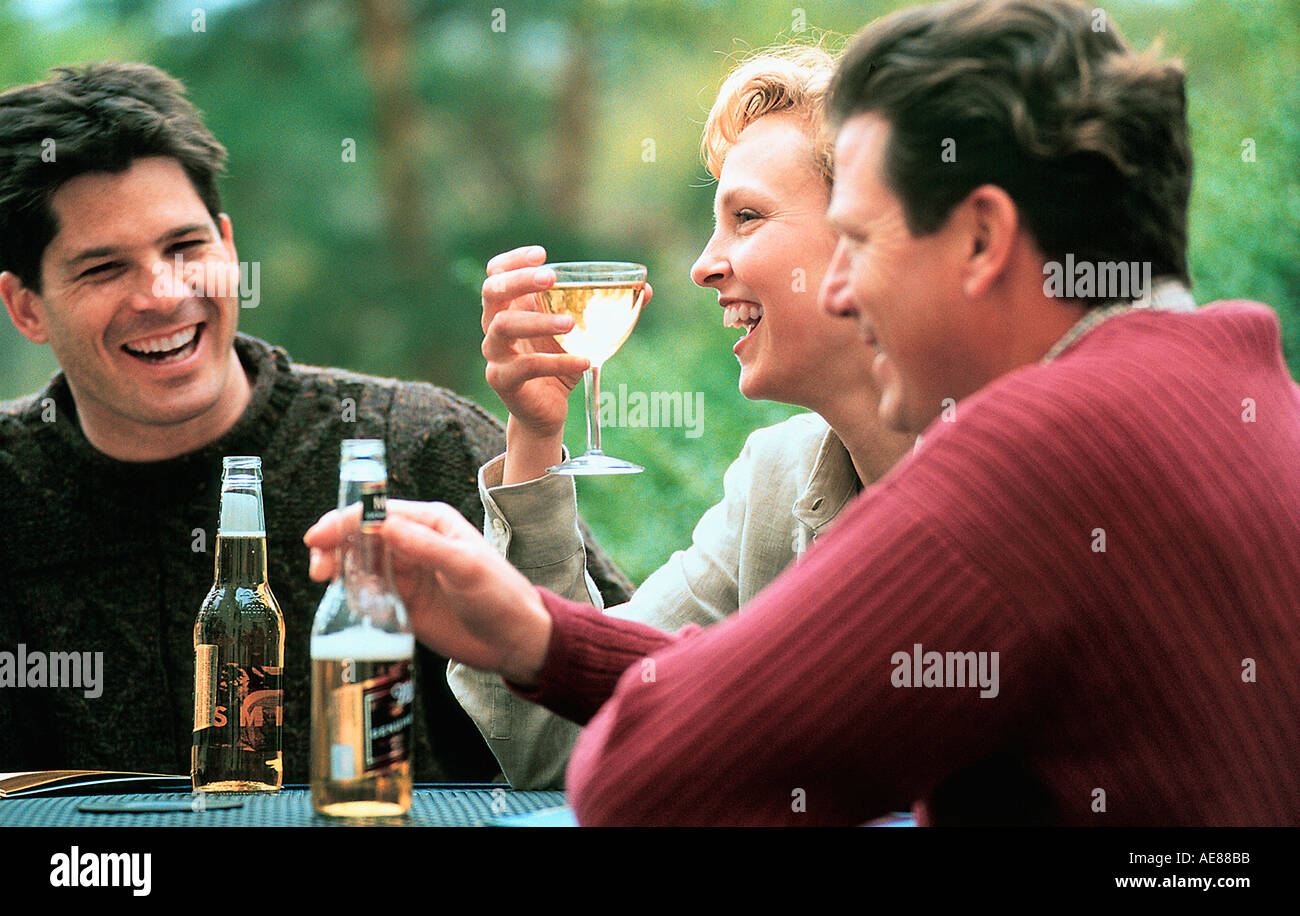 30 s group laughing over drinks Stock Photo - Alamy