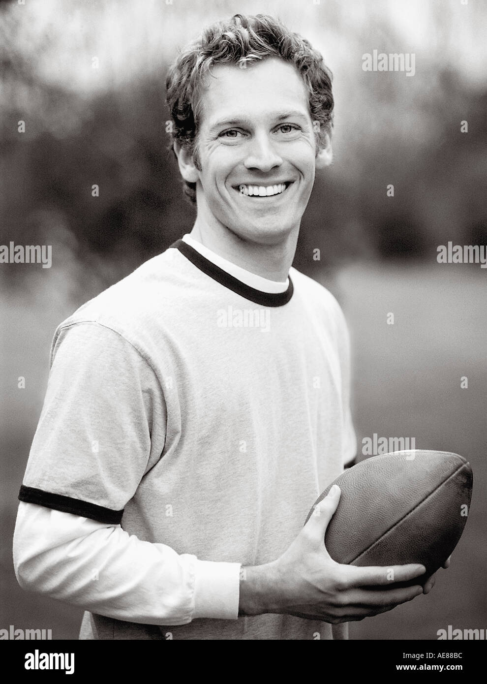 B W man with rugby ball Stock Photo - Alamy