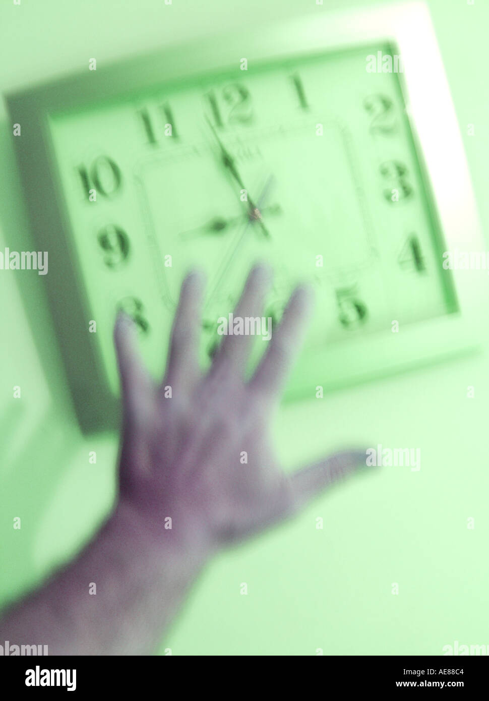 Hand and clock Stock Photo - Alamy