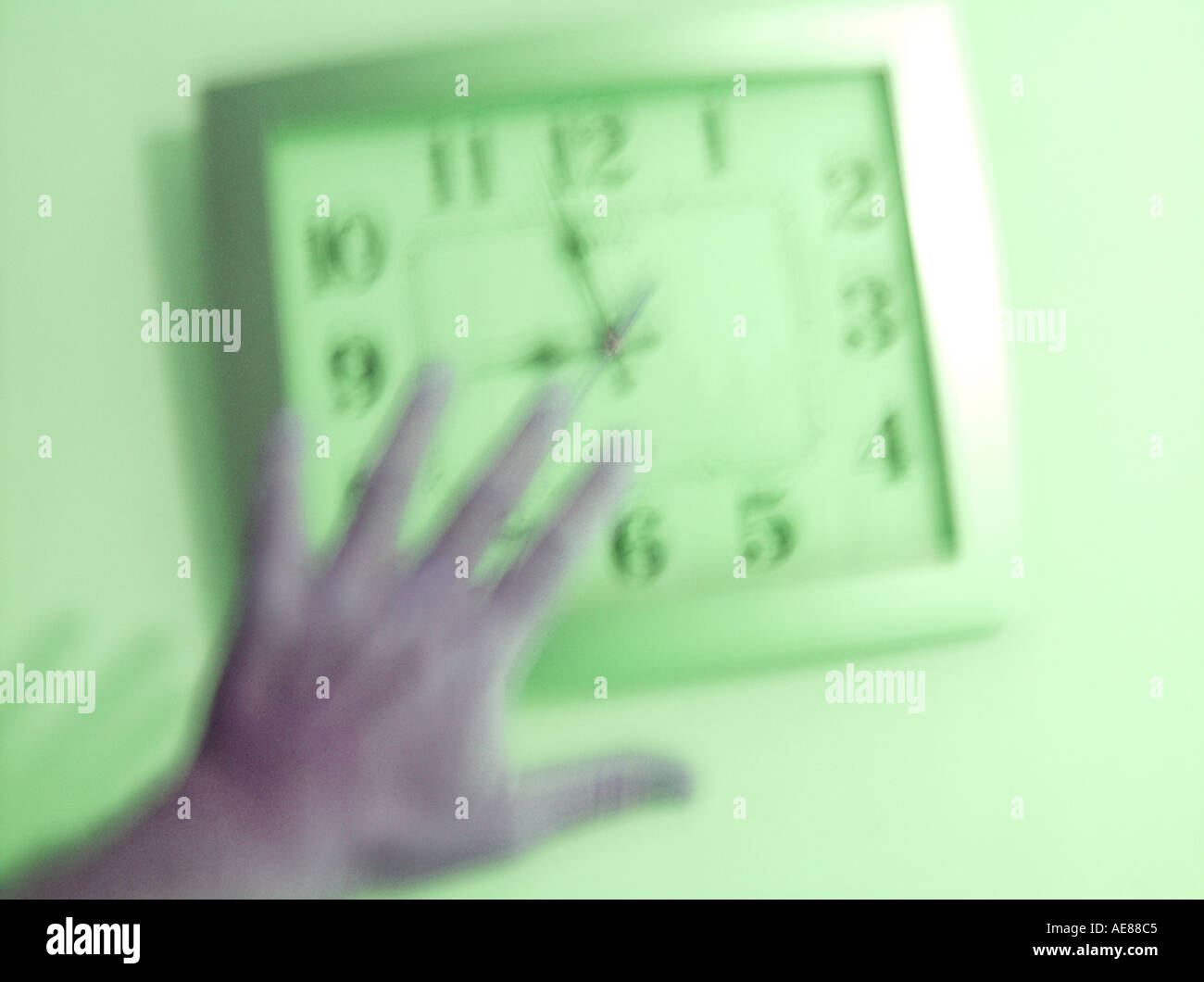 Hand and clock Stock Photo - Alamy